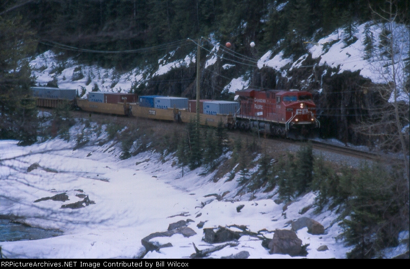 CP 8734 pulls a westbound along the Kicking Horse River
